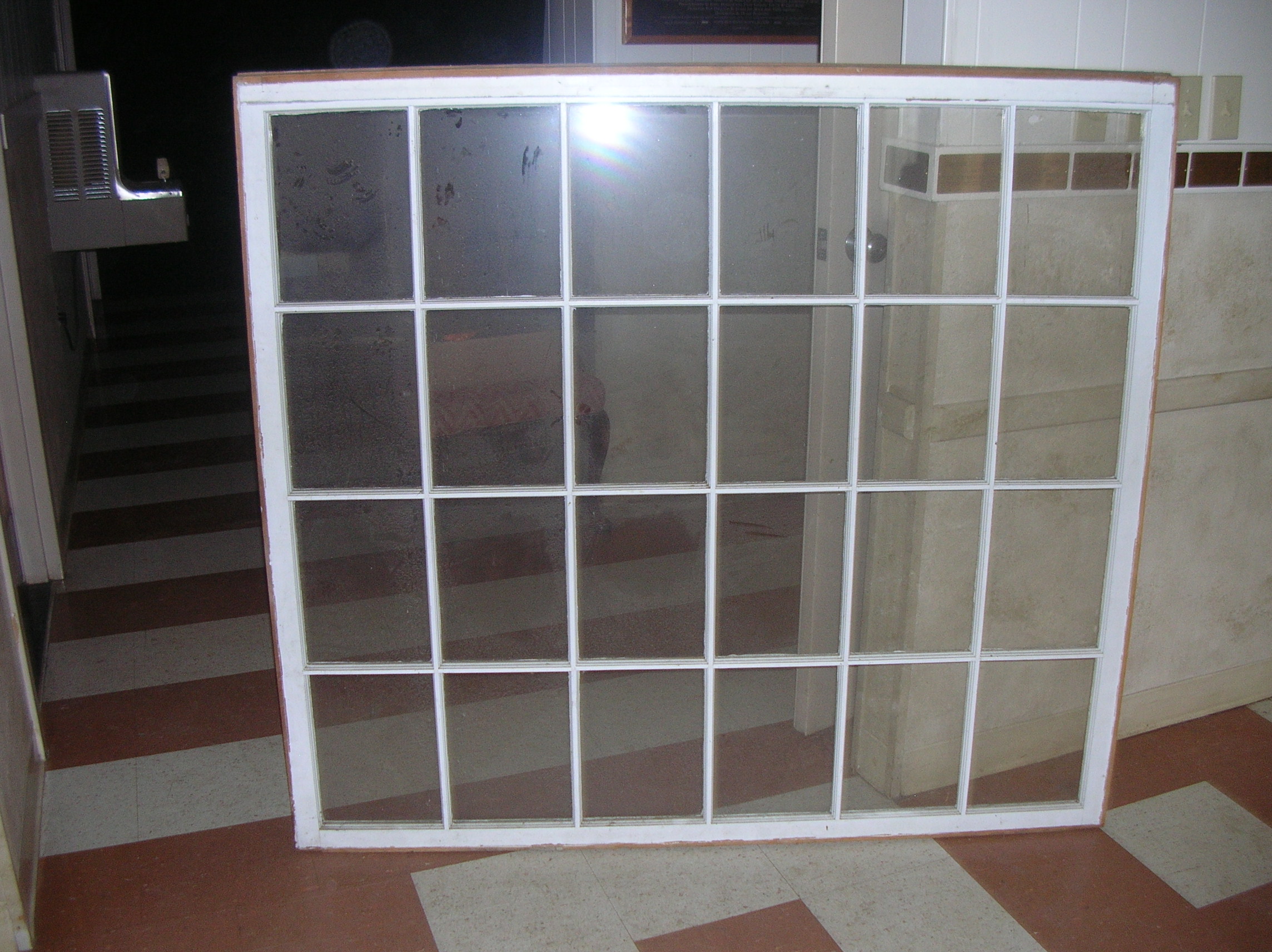 The 100 year old window before installation. – Maine Military Museum